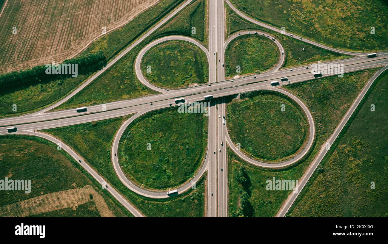 Clover or daisy, simple and cheap type of road junction. Aerial view of ...