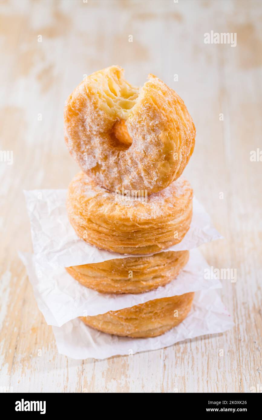 Cronuts - delicious fusion of croissant and donut. Half-donut and half ...