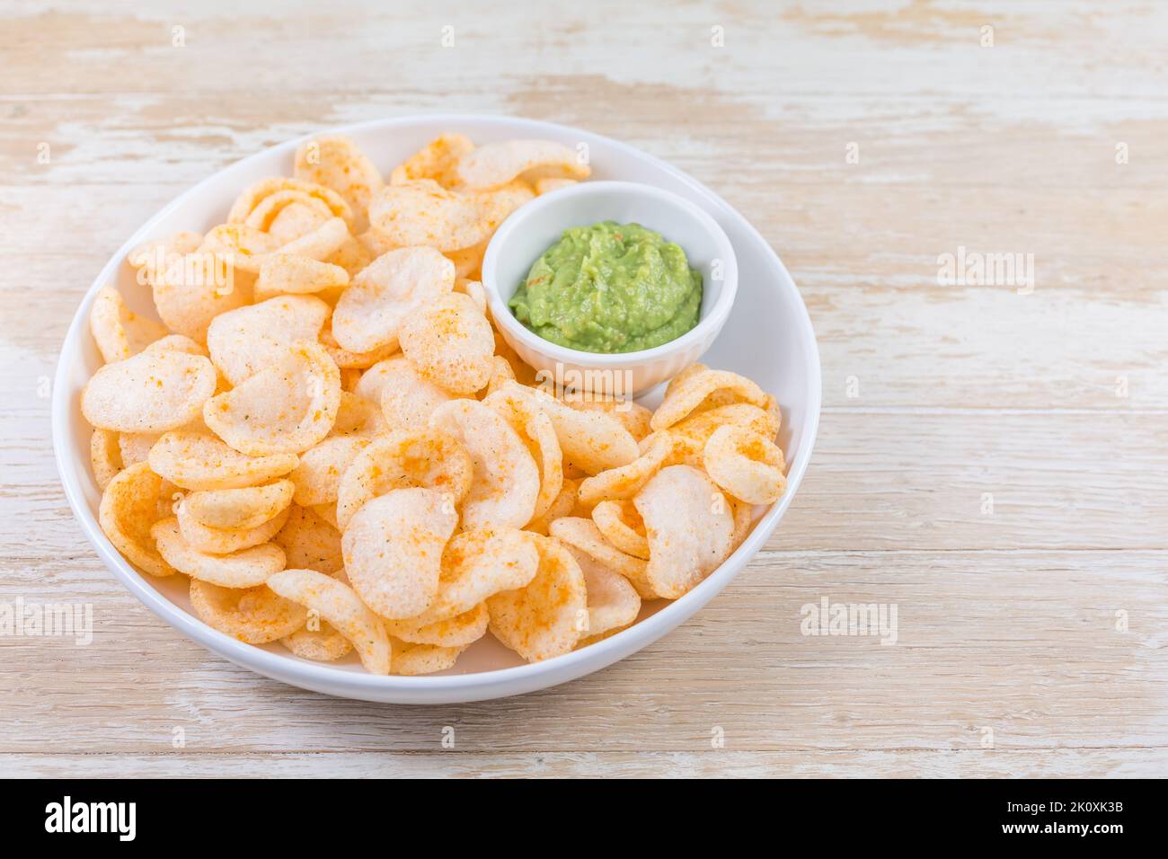 Fried shrimp cracker in thai style. Shrimp cracker with avocado dip on ...