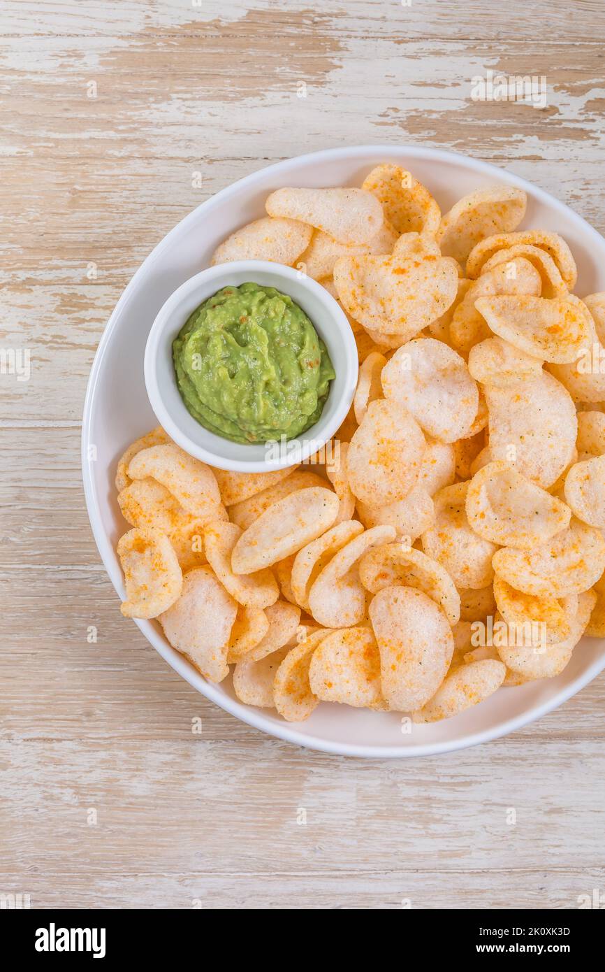 Fried shrimp cracker in thai style. Shrimp cracker with avocado dip on ...