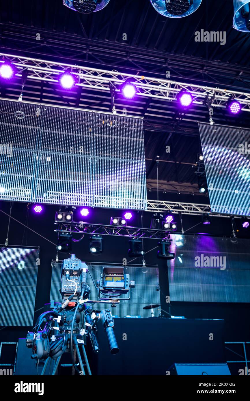 Professional cameraman setting camera in hi-res stock photography and ...