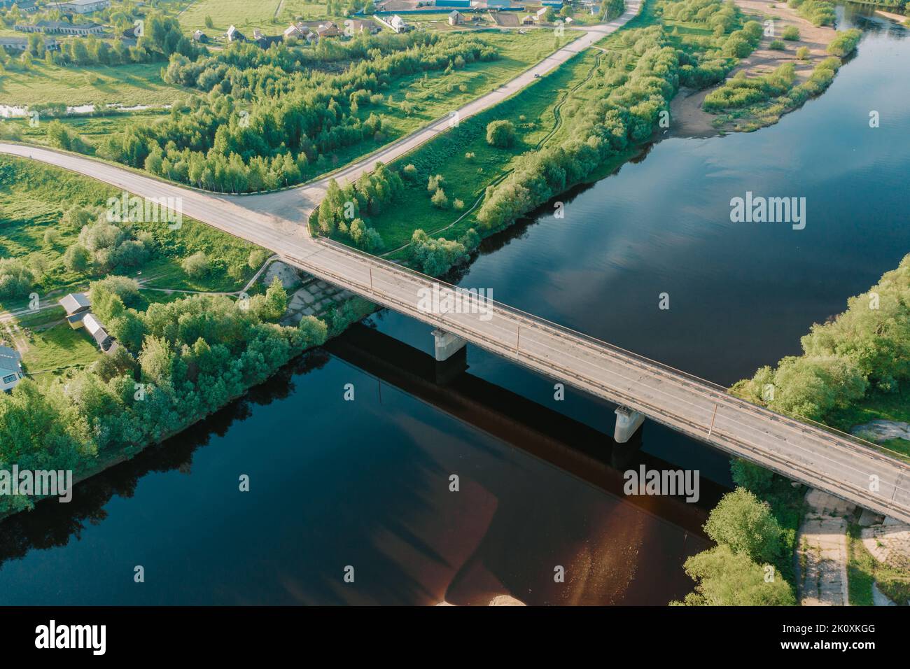 Drone view of empty car bridge crossing beautiful blue river. Aerial ...