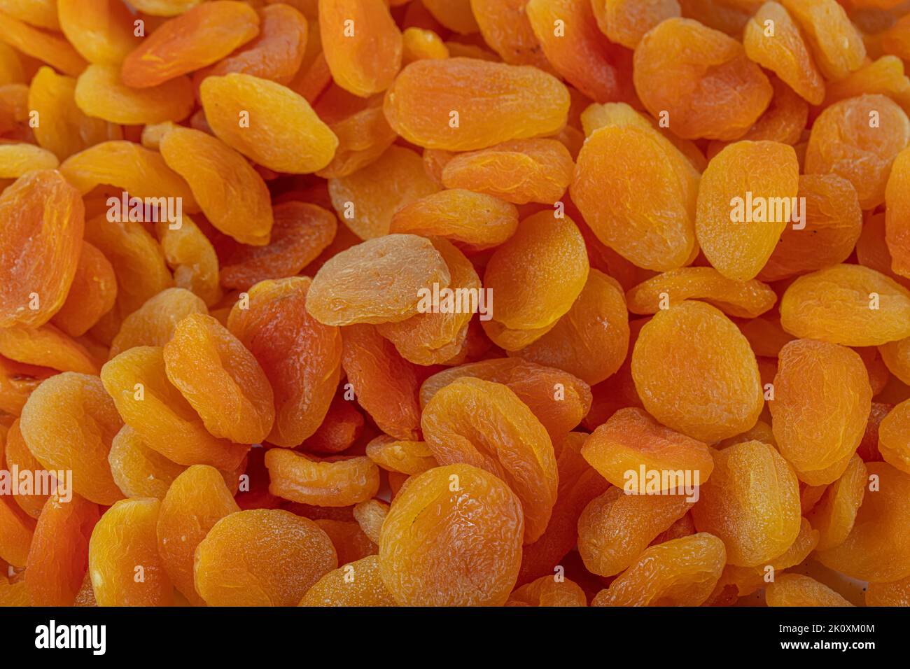 Dried raw apricots fruit background. Dried apricot heap isolated on ...