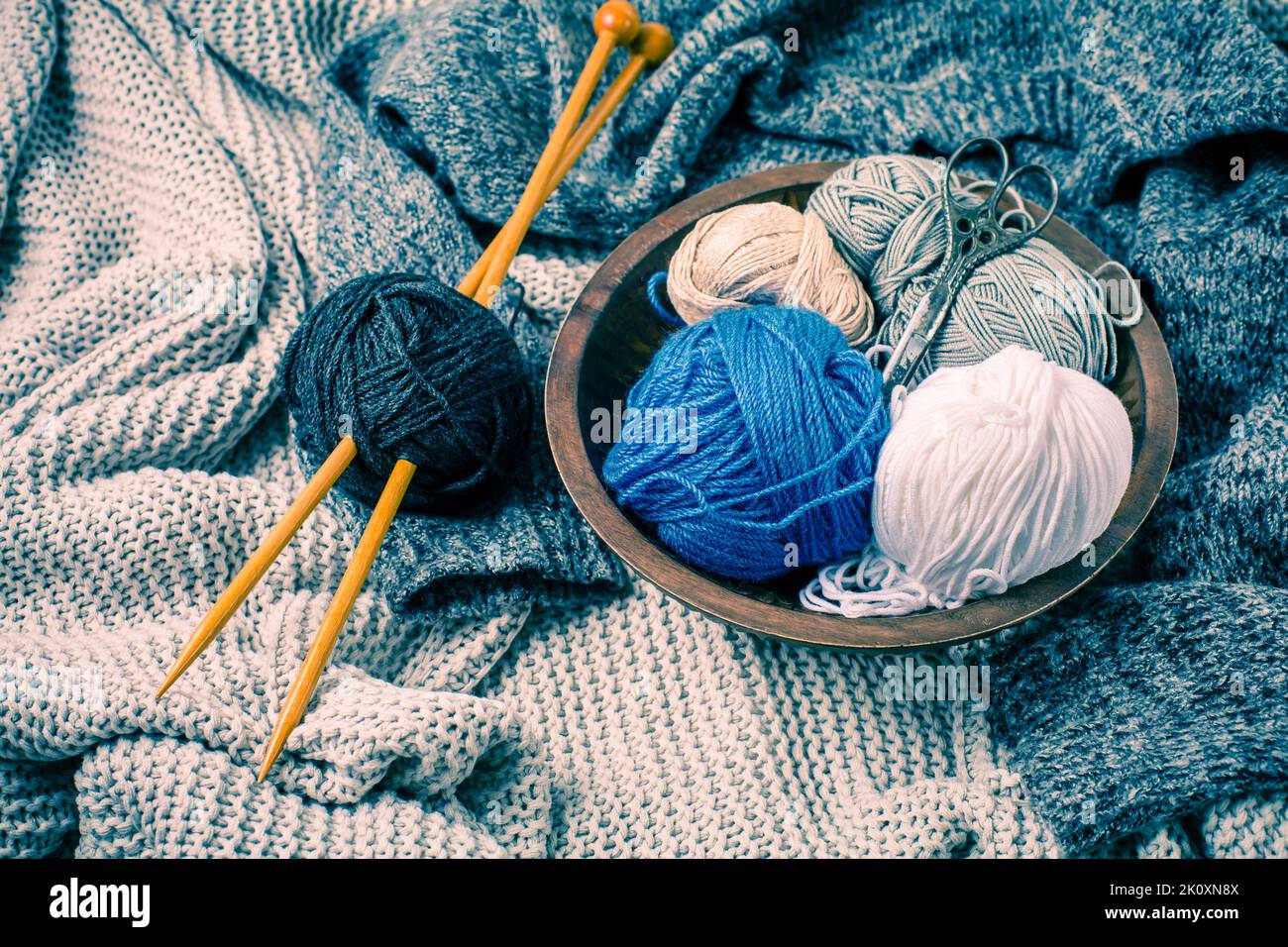 Wool with sweaters and knitting needles - concept of recycling and ...