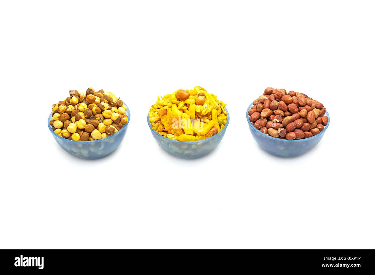 The sets of the roasted gram, peanut, and mixture of namkeen snacks in ...