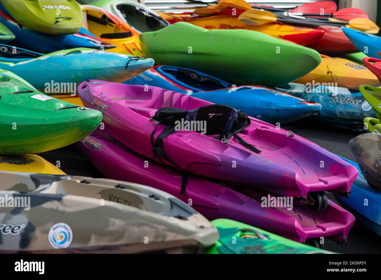 Kayaks, colorful kayaks on display for sale at small trade fair ...