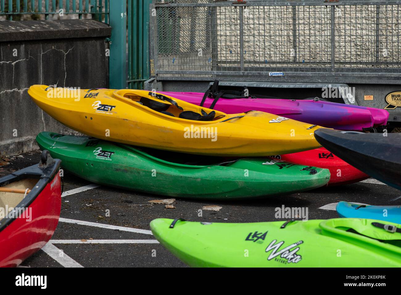 Kayaks, colorful kayaks on display for sale at small trade fair ...