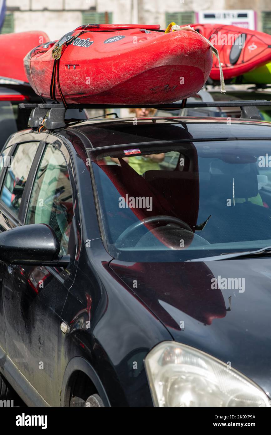 Kayaks, colorful kayaks on display for sale at small trade fair ...