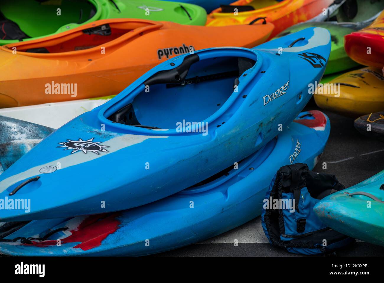 Kayaks, colorful kayaks on display for sale at small trade fair ...