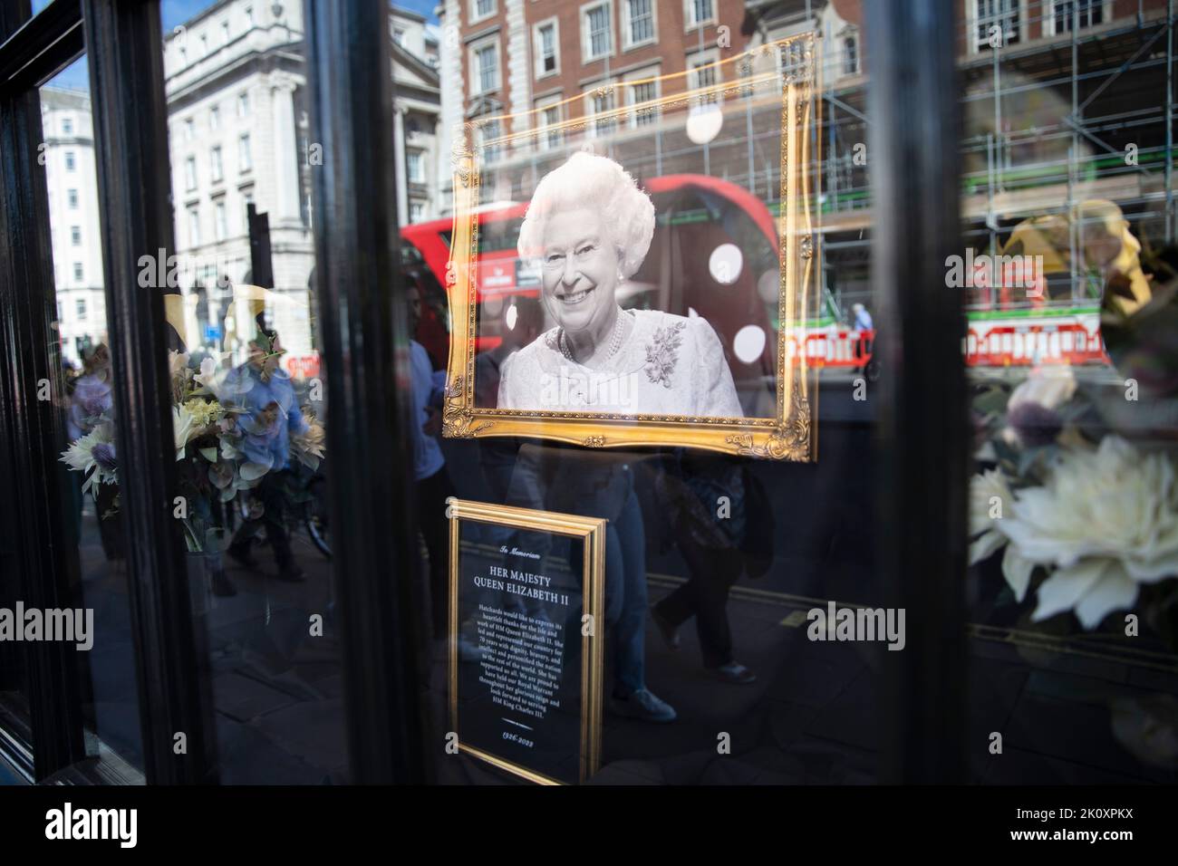 LONDON, UK - September 2022: A sign in a shop window paying tribute to ...