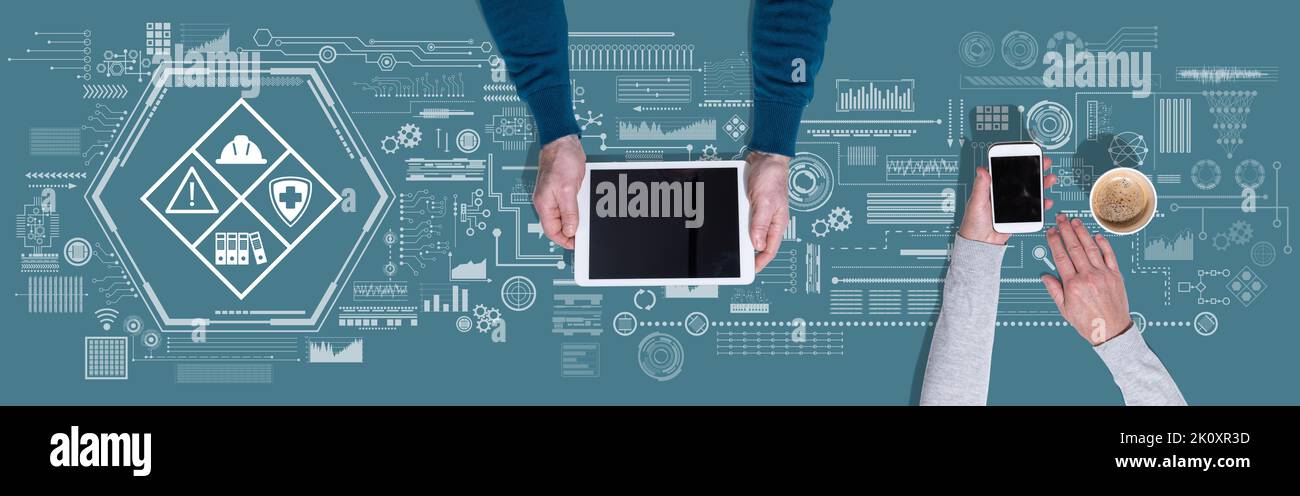 Top view of hands using digital tablet and mobile phone with symbol of ...