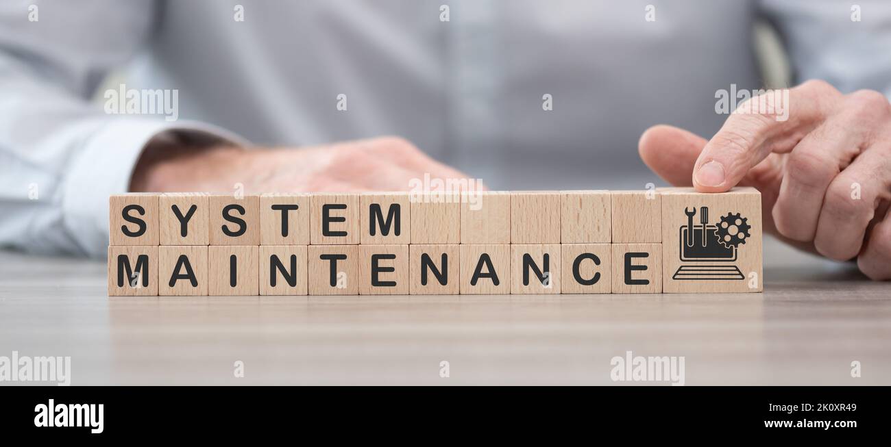 Wooden blocks with symbol of system maintenance concept Stock Photo - Alamy