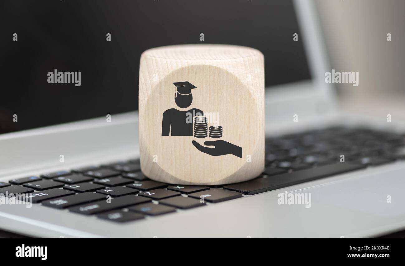 Wooden block with symbol of fafsa concept on laptop keyboard Stock ...