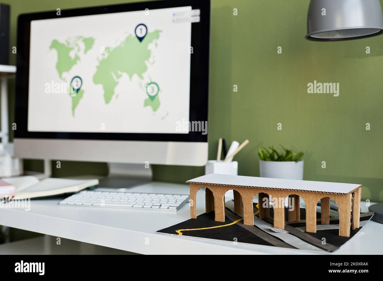 Horizontal image of construction mockup on table with computer monitor ...
