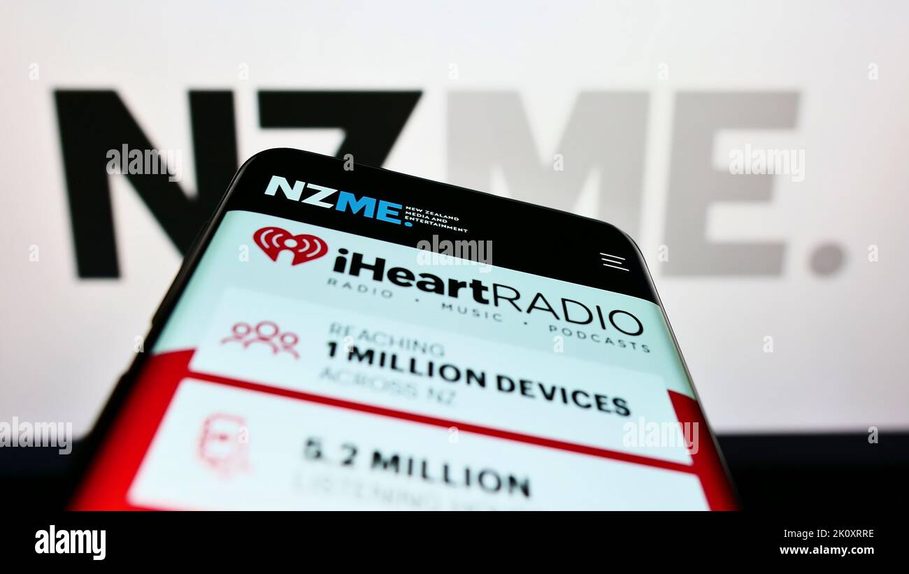Smartphone with website of company New Zealand Media and Entertainment ...