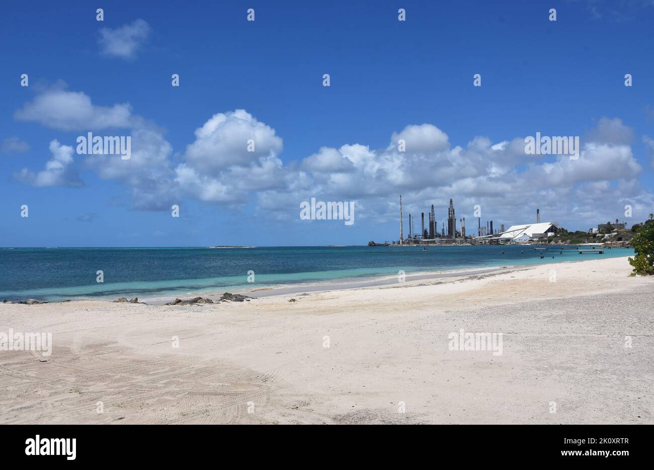 Oil refinery views from the white sands of Rodgers Beach in Aruba Stock ...