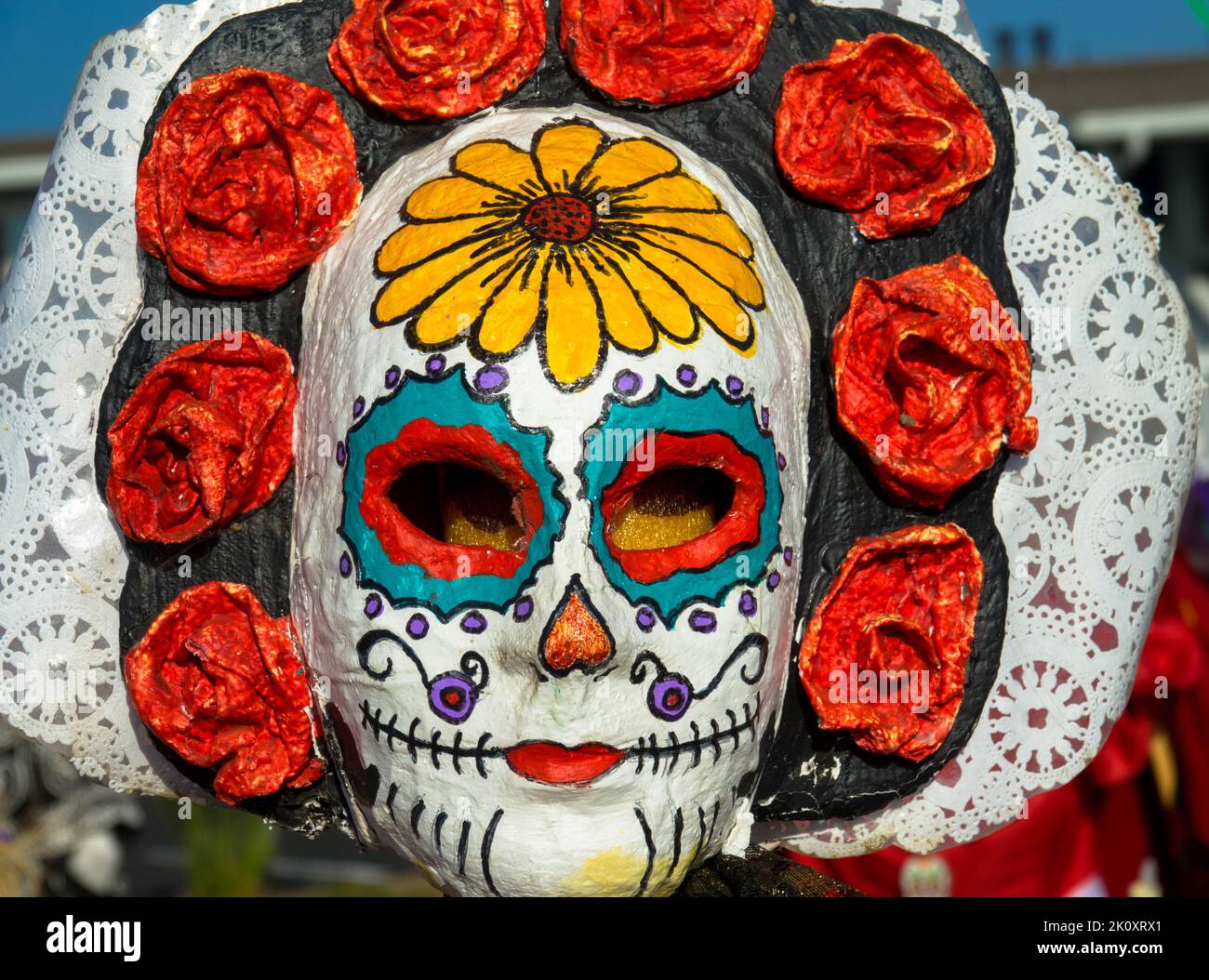 Painted human skull with flowers for Mexico's Day of the Dead. Close up ...