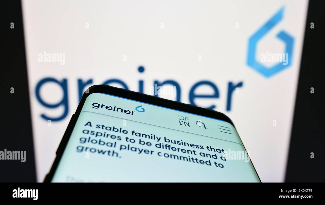 Mobile phone with website of Austrian plastics company Greiner AG on ...