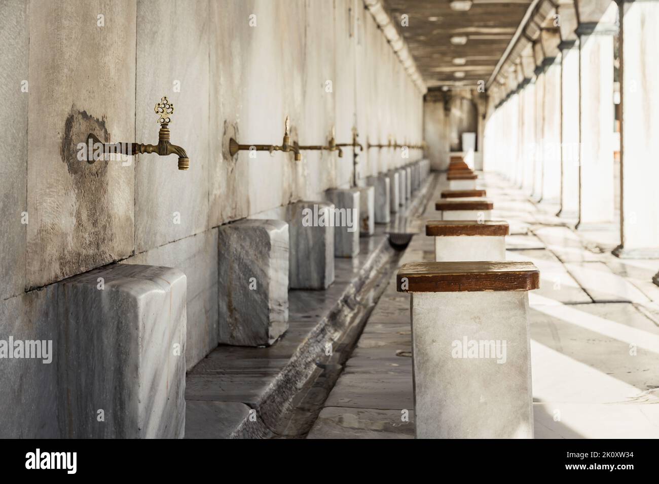 Washing area before entering in Mosque. Ablution room Stock Photo - Alamy