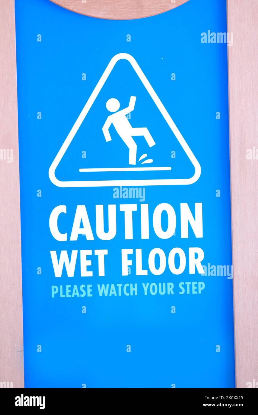 Caution wet floor or cleaning in progress. A yellow sign warning for ...