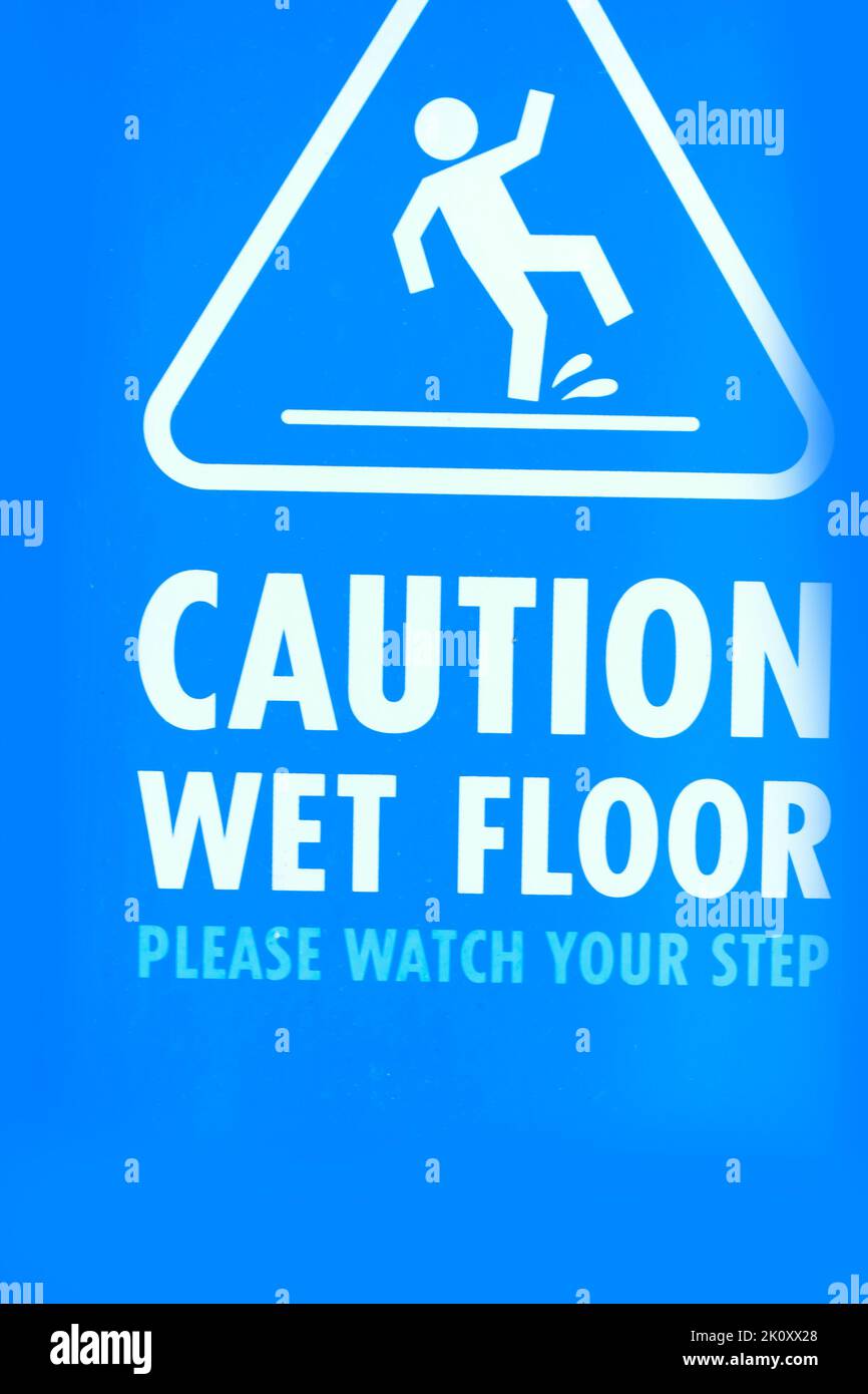 Caution wet floor or cleaning in progress. A yellow sign warning for ...