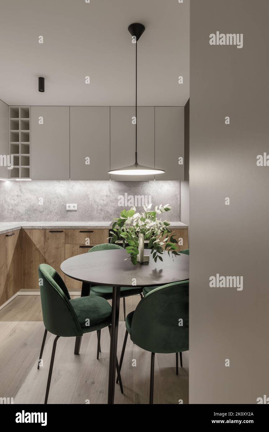 Modern minimalistic kitchen and dining room interior with wooden and ...