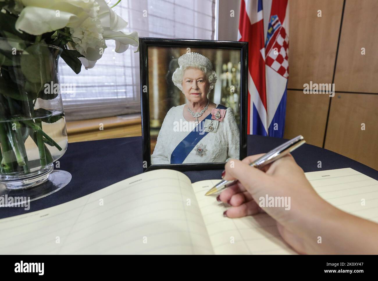 Zagreb, Croatia. 14th Sep, 2022. Embassy personel signs the book of ...