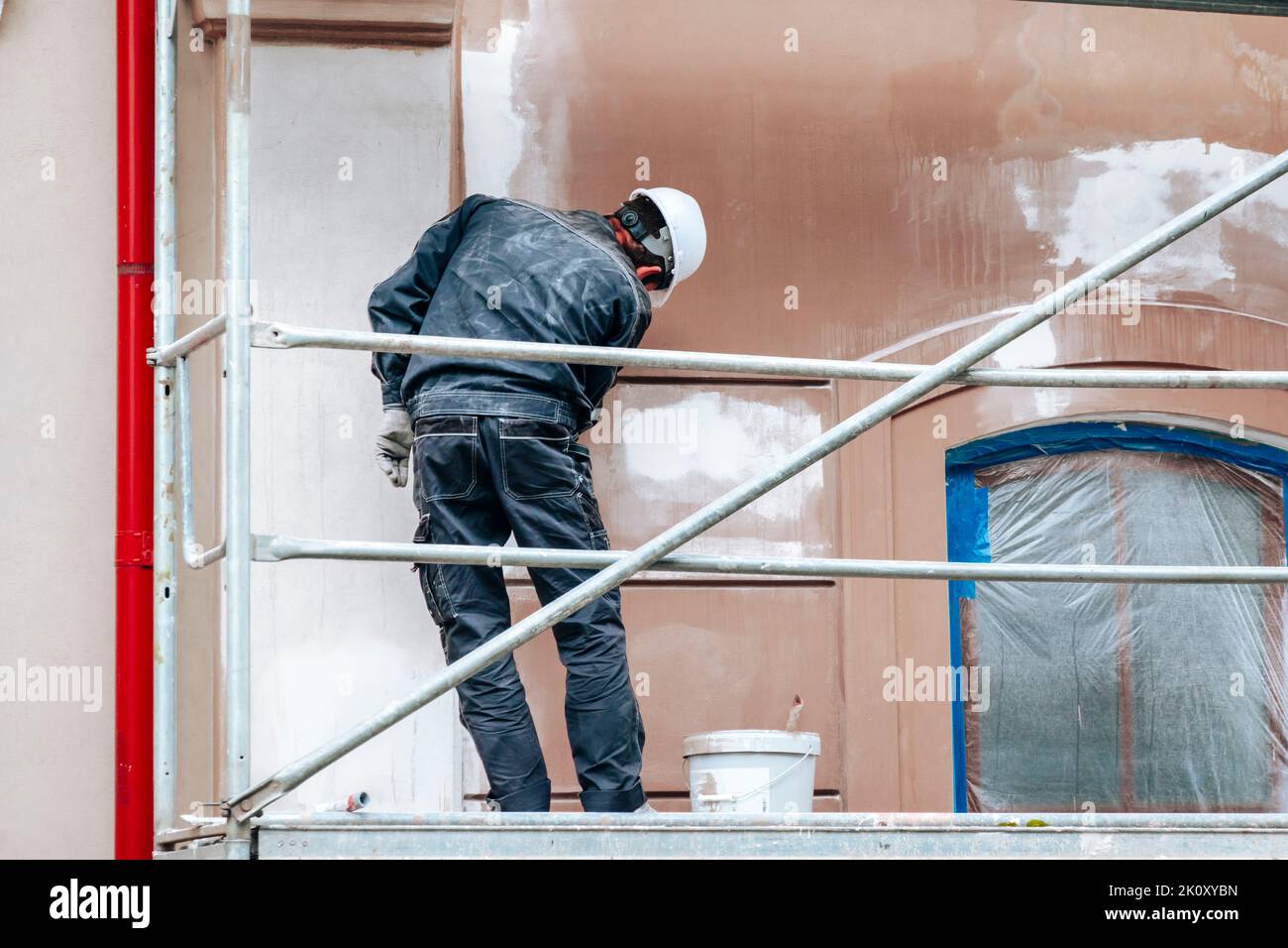 Renovation, restoration, refurbishment. Unrecognizable worker ...