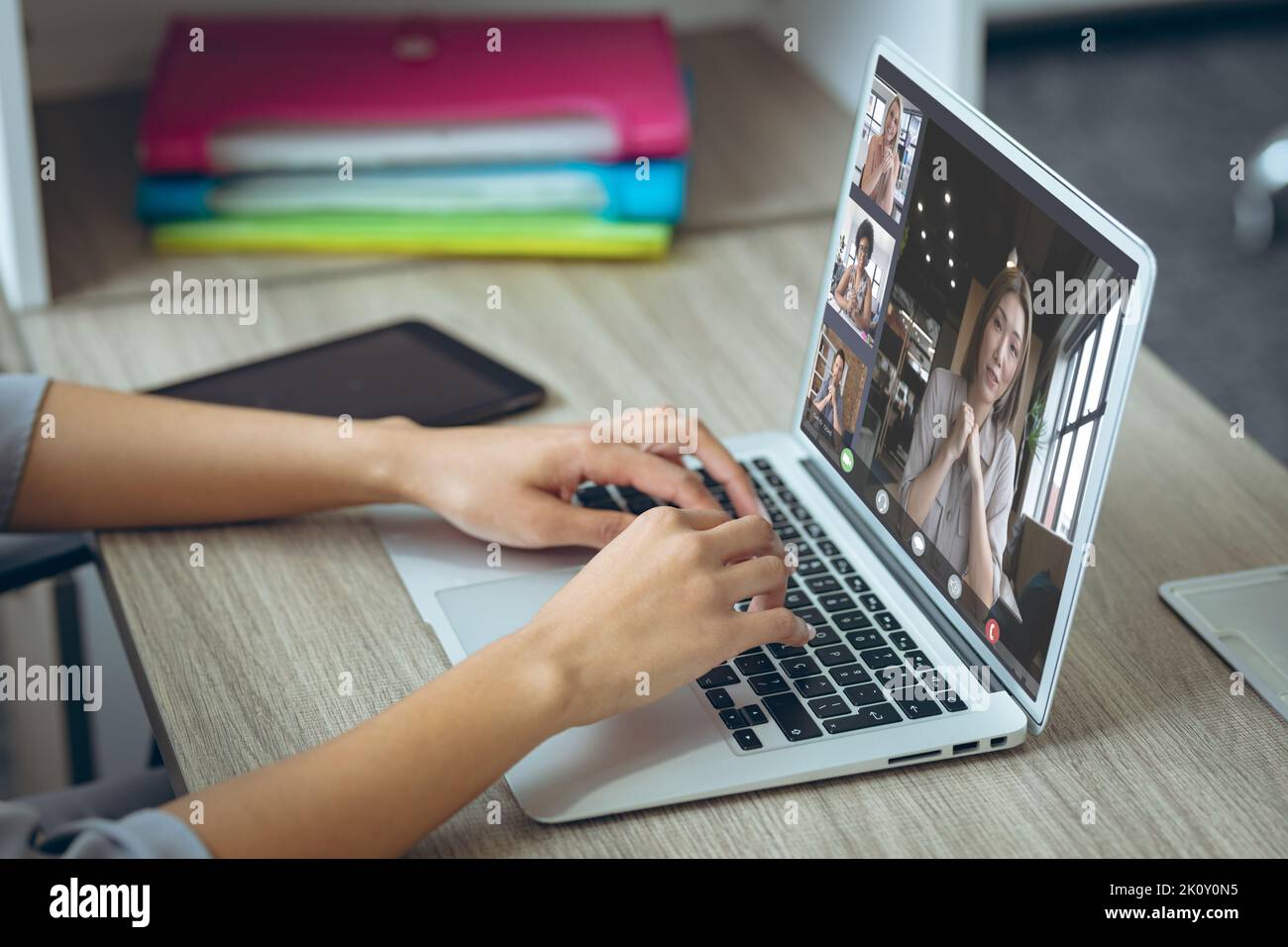 Hands of caucasian businesswoman at desk making laptop video call with ...
