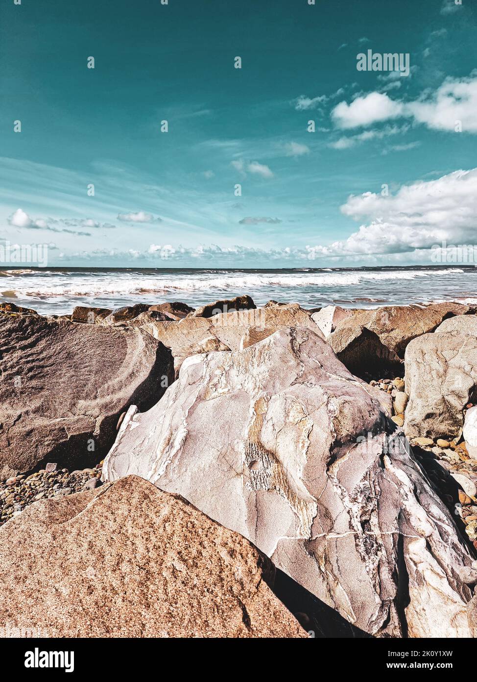 A vertical view of the Dinas Dinlle North Wales with crystal clear sea ...