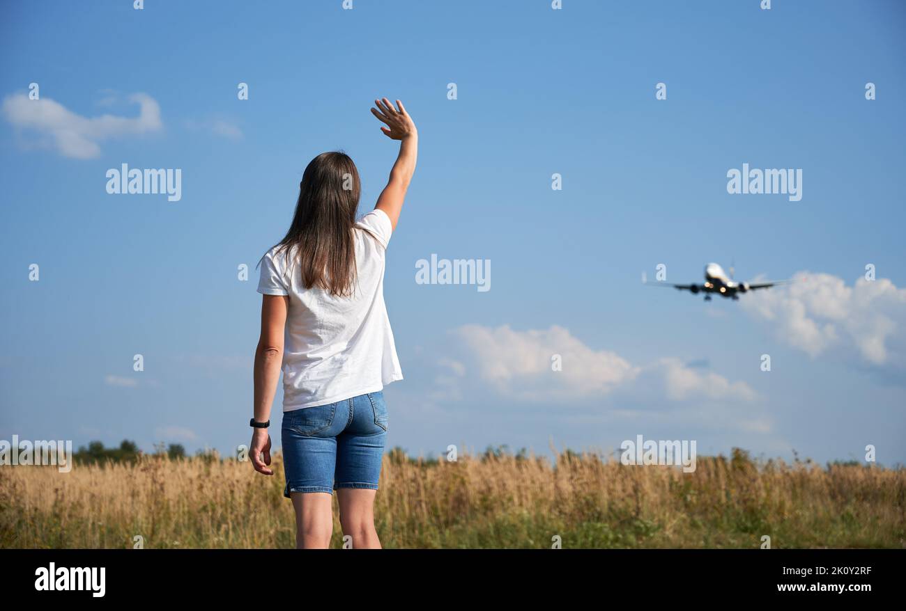 Woman aeroplane waving hi-res stock photography and images - Alamy