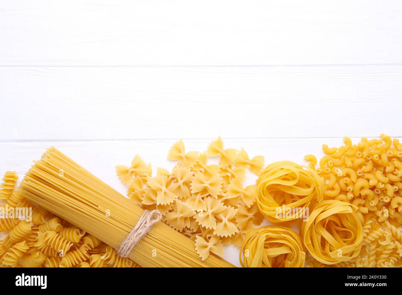 Delicious mixed pasta on wooden background with copy space Stock Photo ...