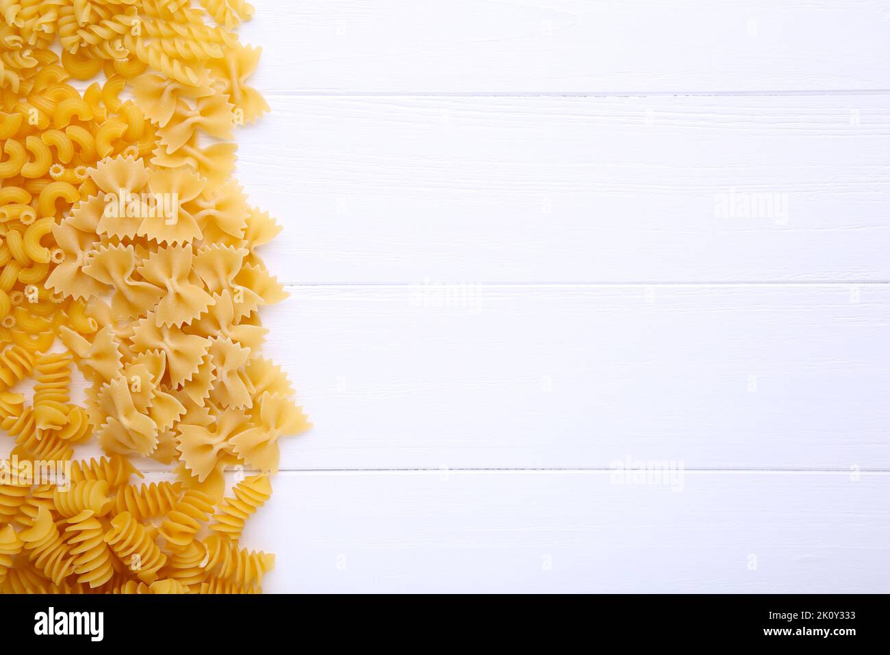 Delicious mixed pasta on wooden background with copy space Stock Photo ...