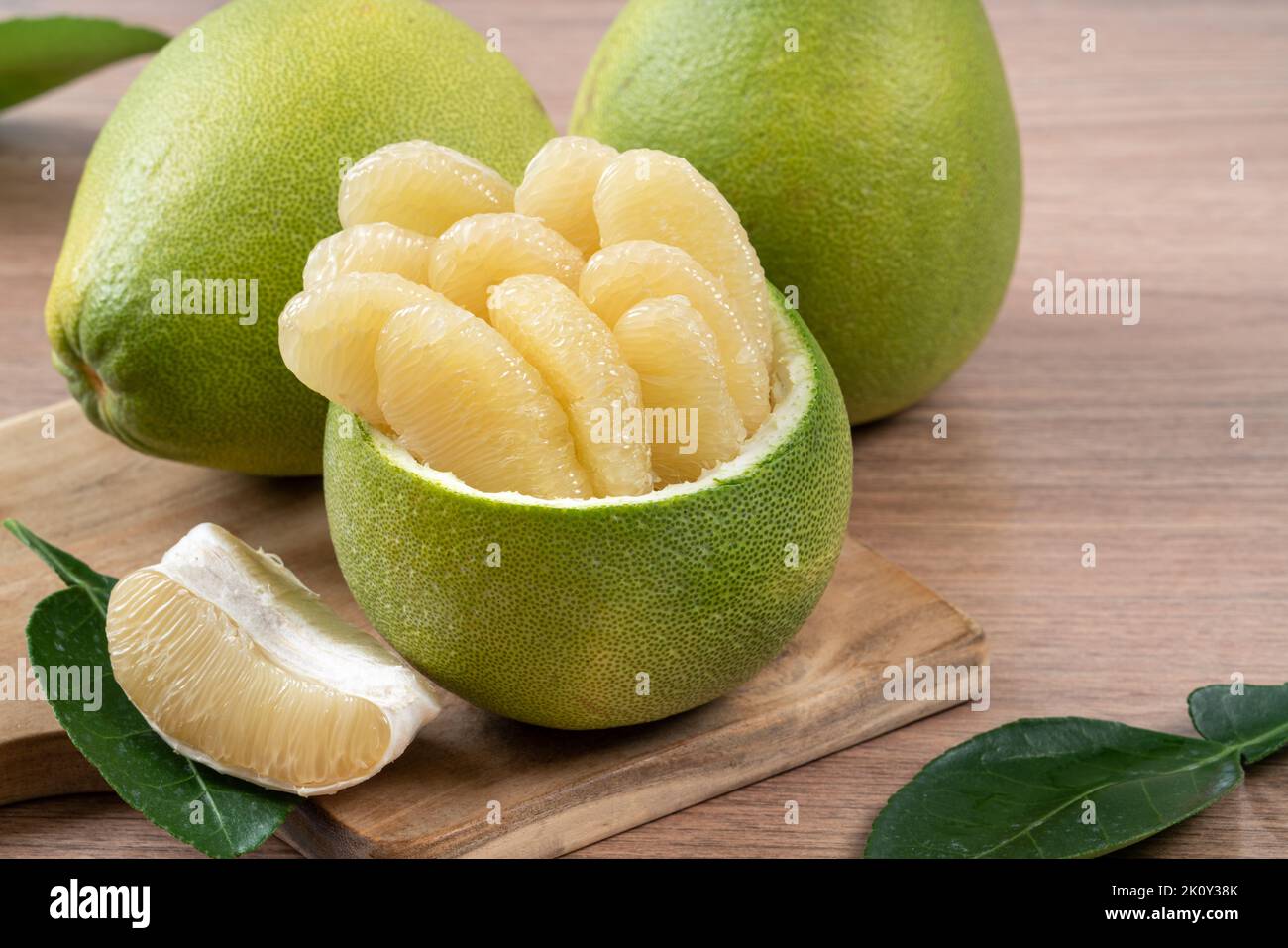 Close up of fresh peeled pomelo on wooden table background for Mid ...