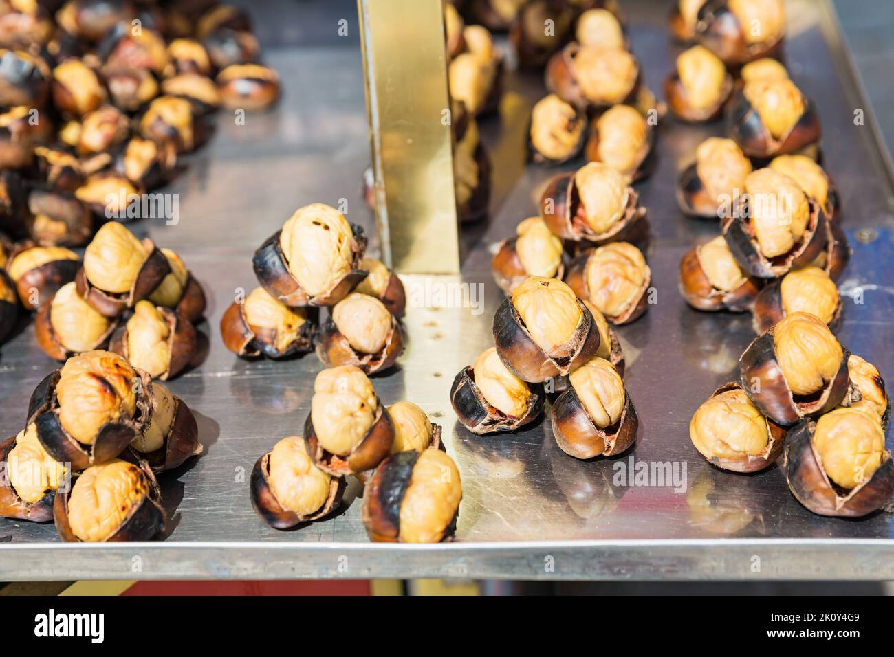 grilled chestnuts for sale on the street. Street fast food Stock Photo ...