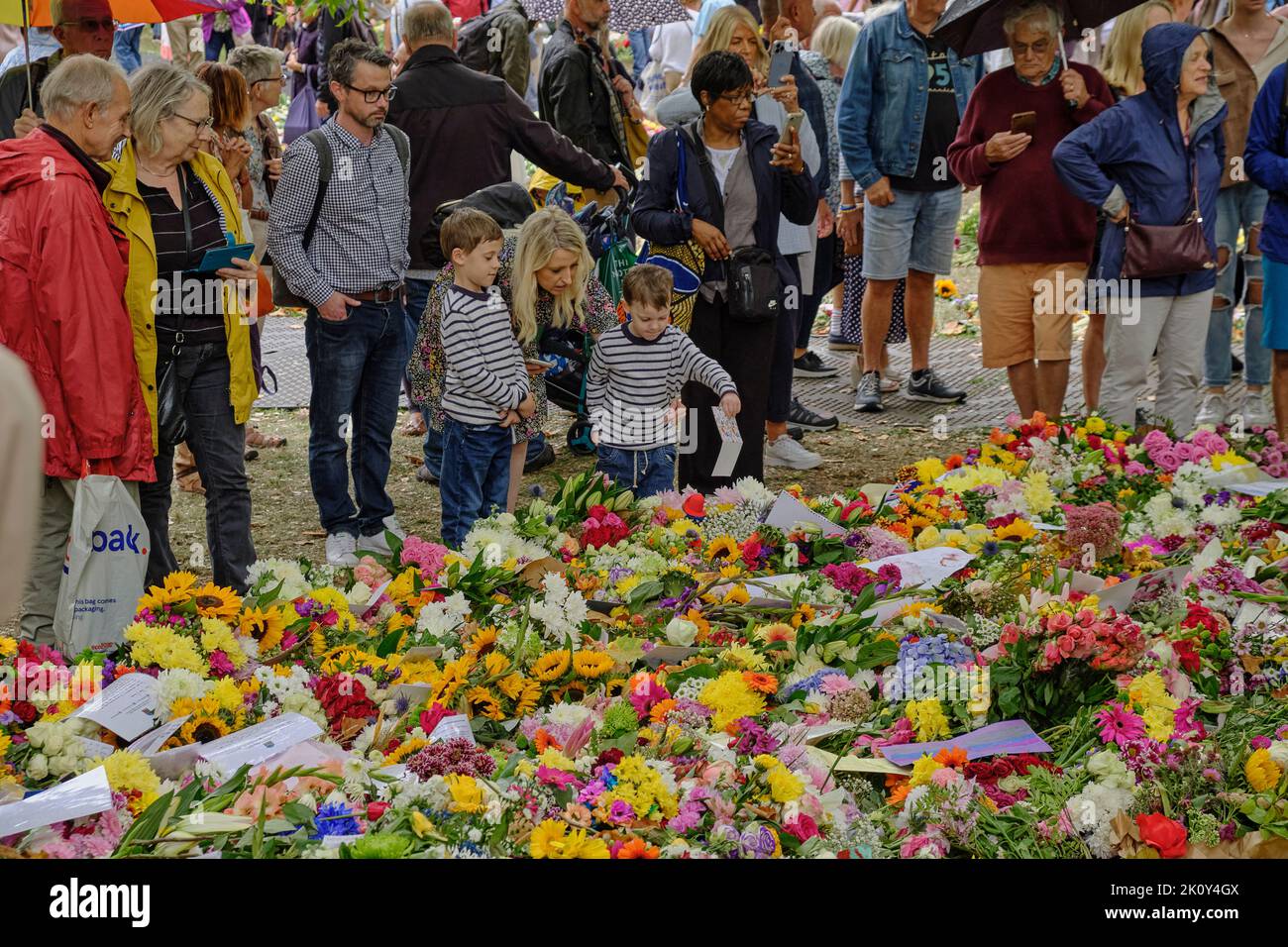Children bring cards and hand drawn pictures as part of a floral ...