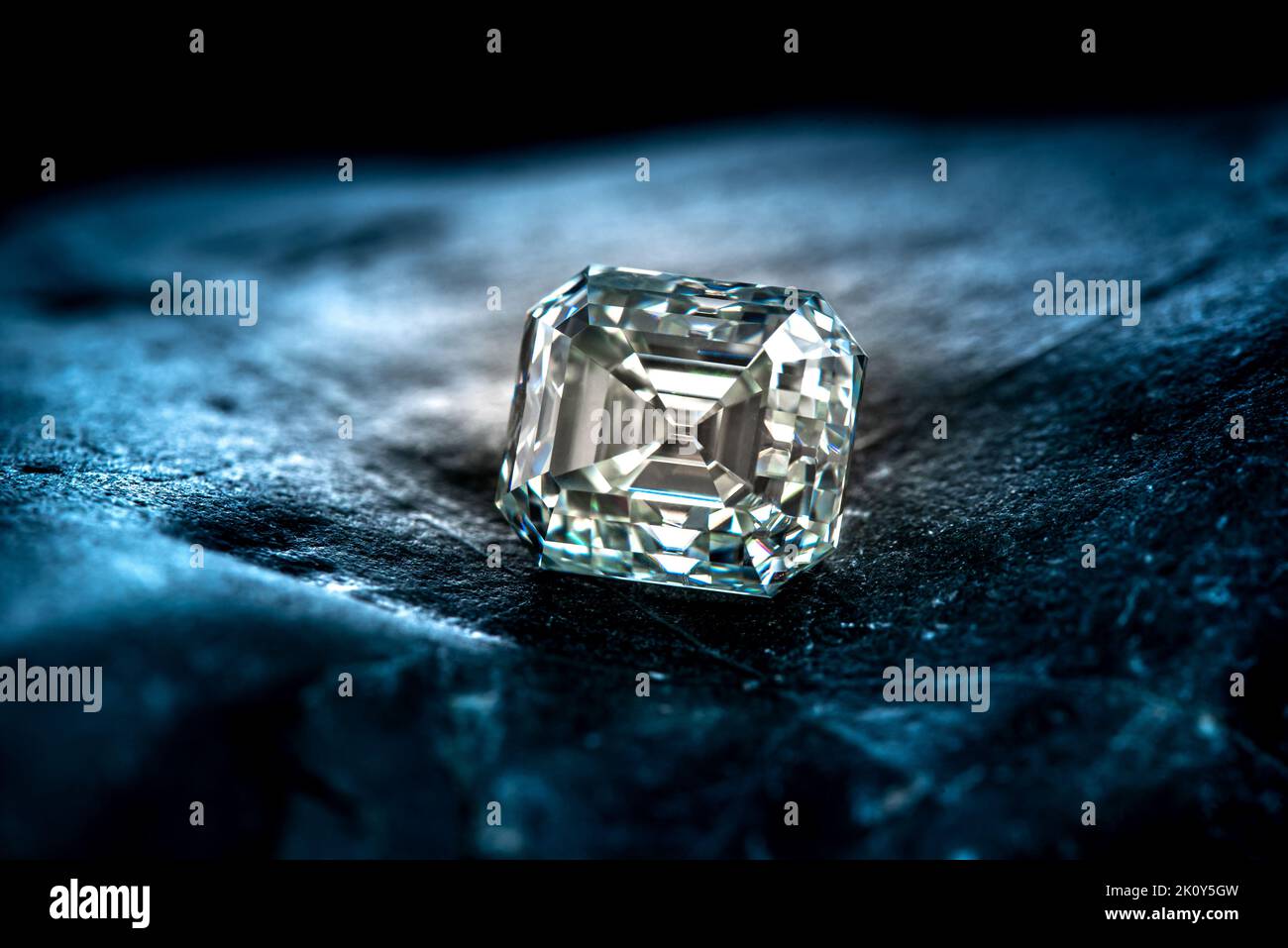 Asscher Cut Diamond on Dark Blue Natural Stone Stock Photo - Alamy