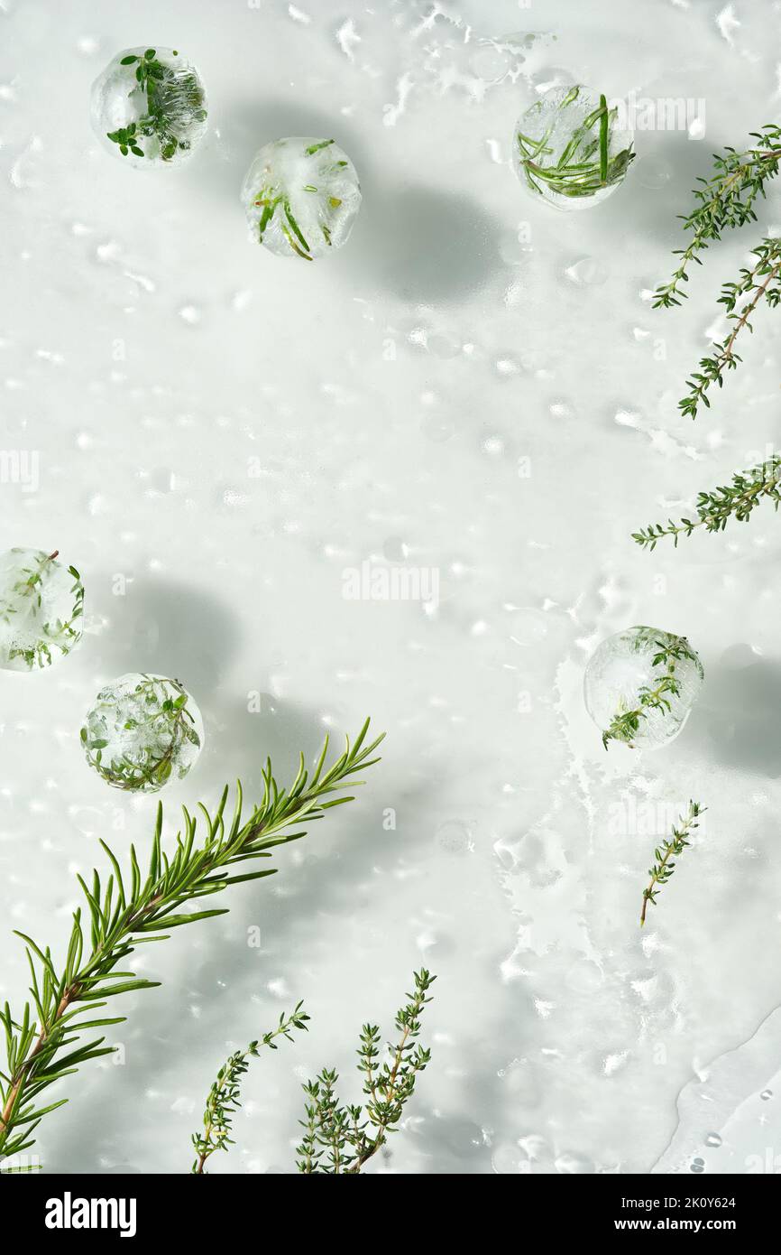 Wet off white water background with melting balls of ice with frozen ...