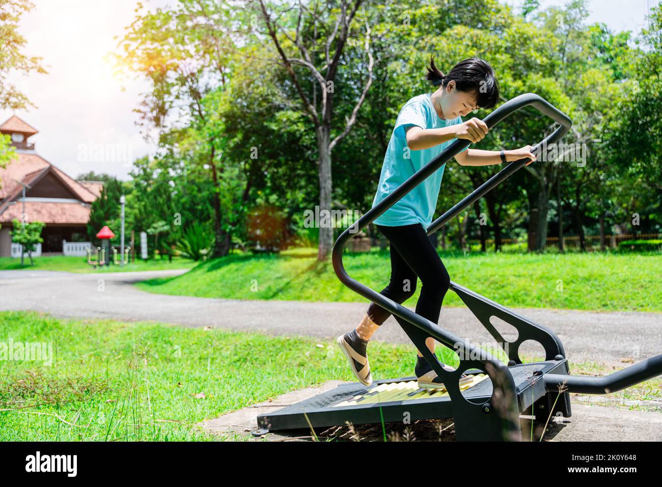 Close up of Child girl running on a treadmill for exercise at the ...