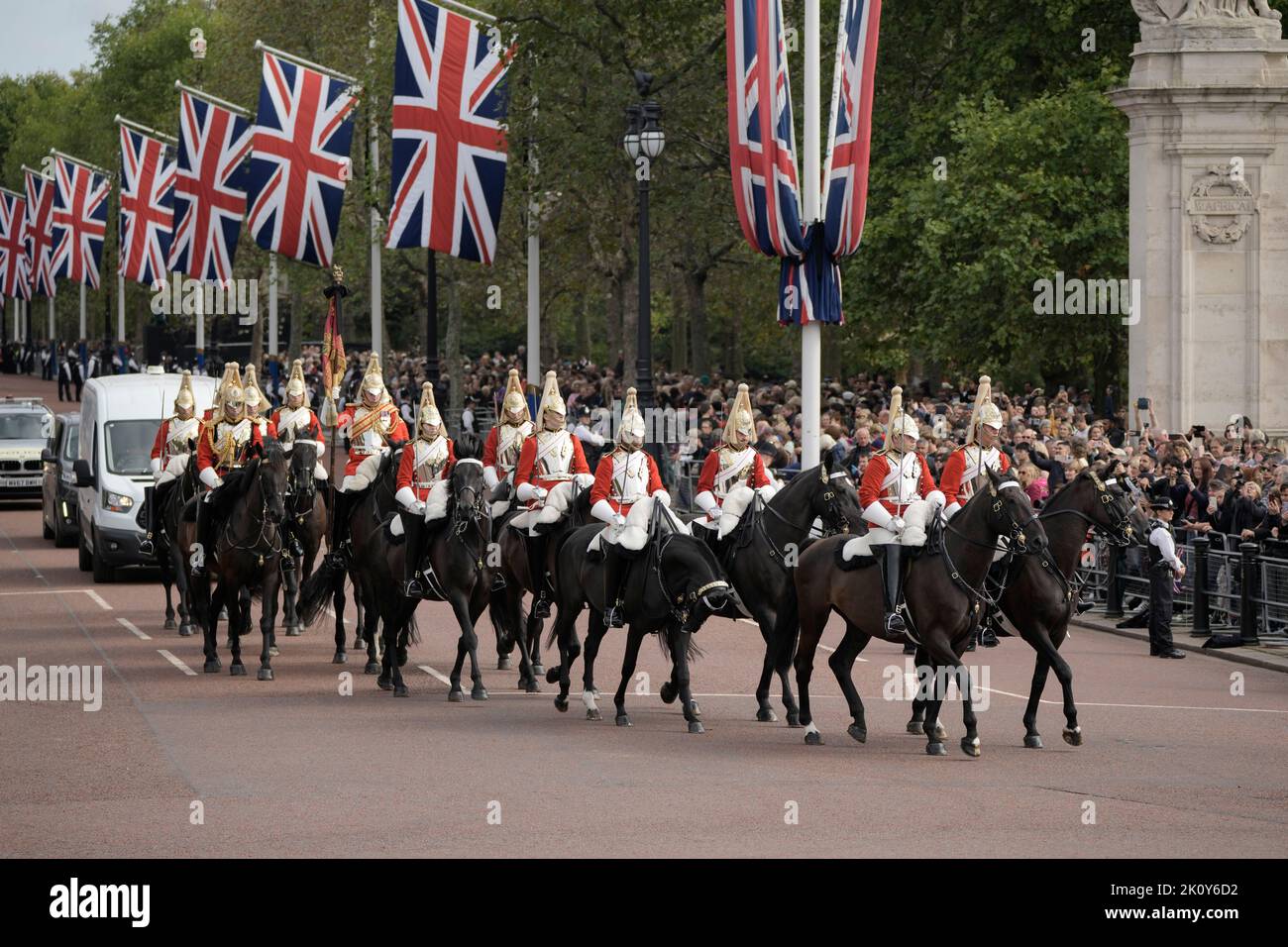 Mounted guards head down The Mall towards Buckingham Palace ahead of ...