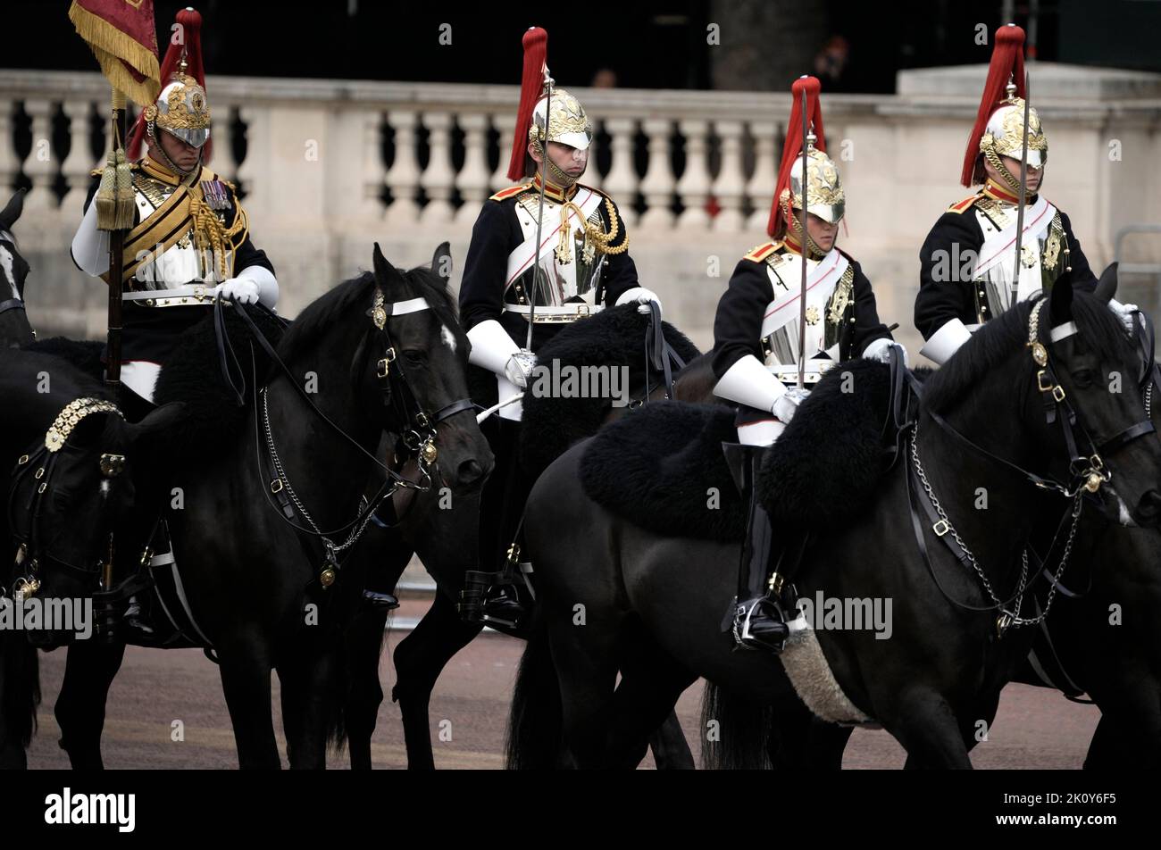 Mounted guards head down The Mall towards Buckingham Palace ahead of ...