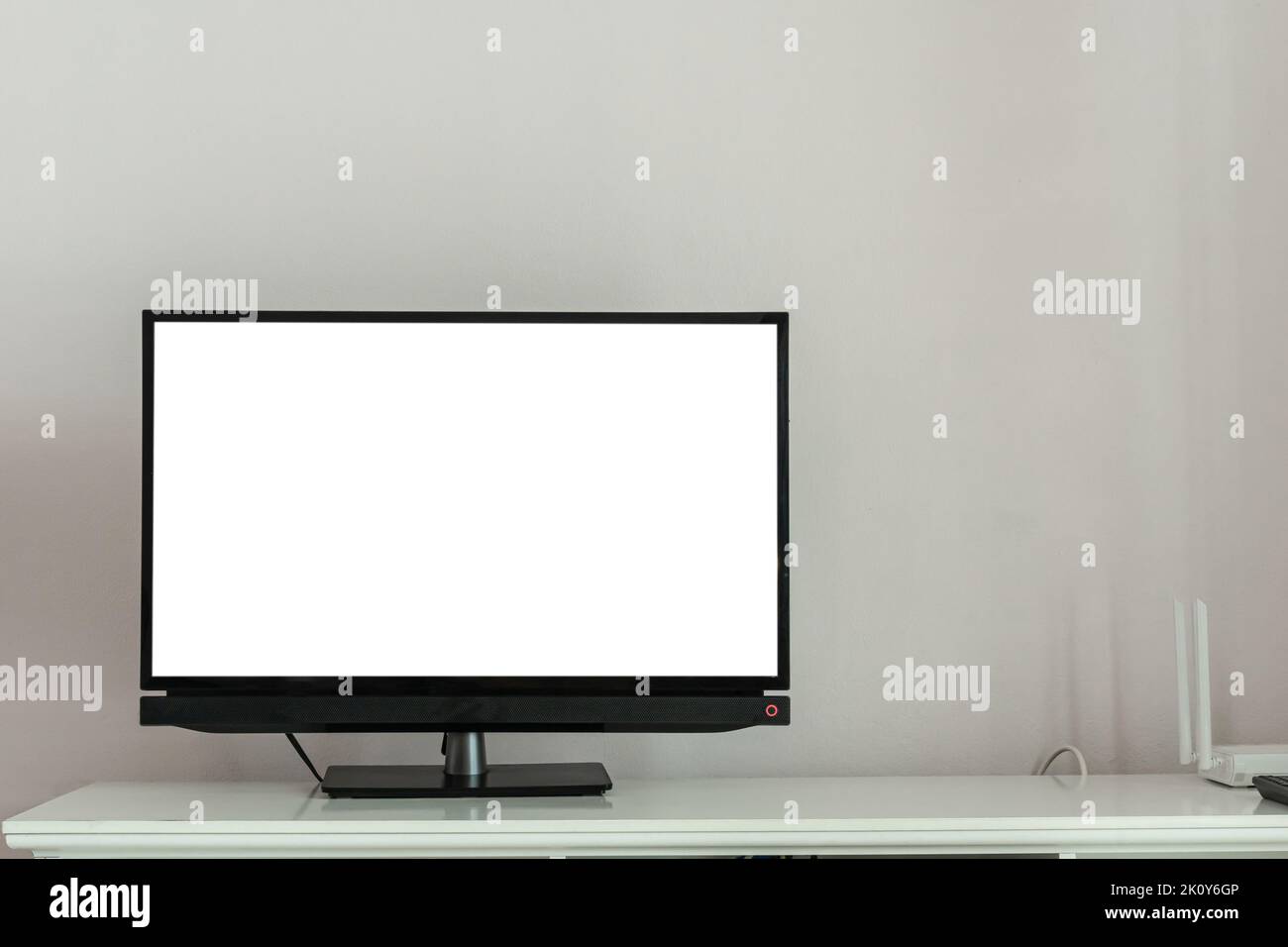 Smart TV screen on white wooden table in living room interior Stock ...