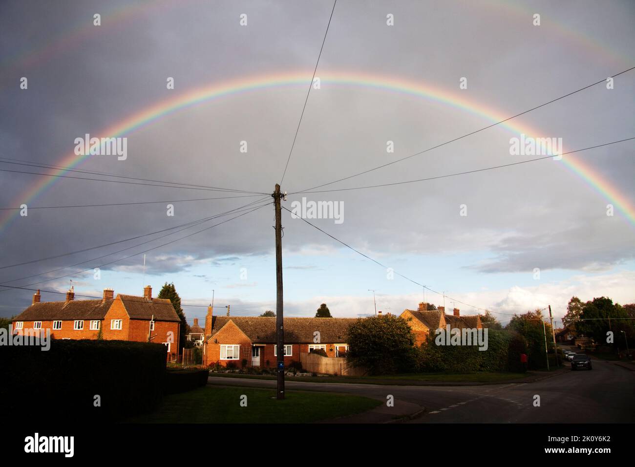 Rainbow over Hook Norton Oxfordshire England uk Stock Photo - Alamy