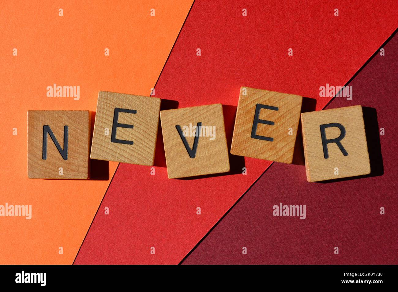 Never, word in wooden alphabet letters isolated on background Stock ...