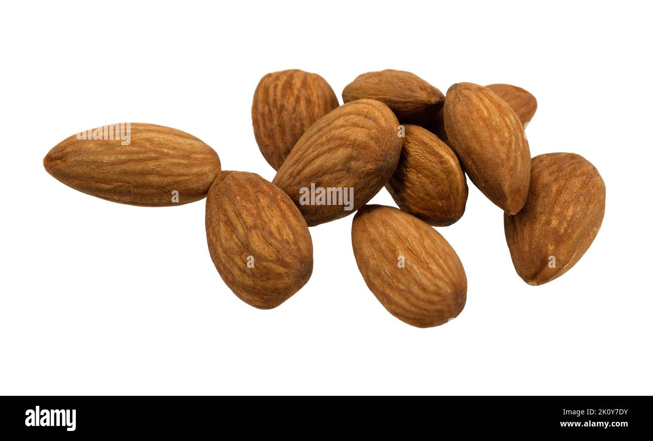 Side view of a portion of almond nuts isolated on a white background ...