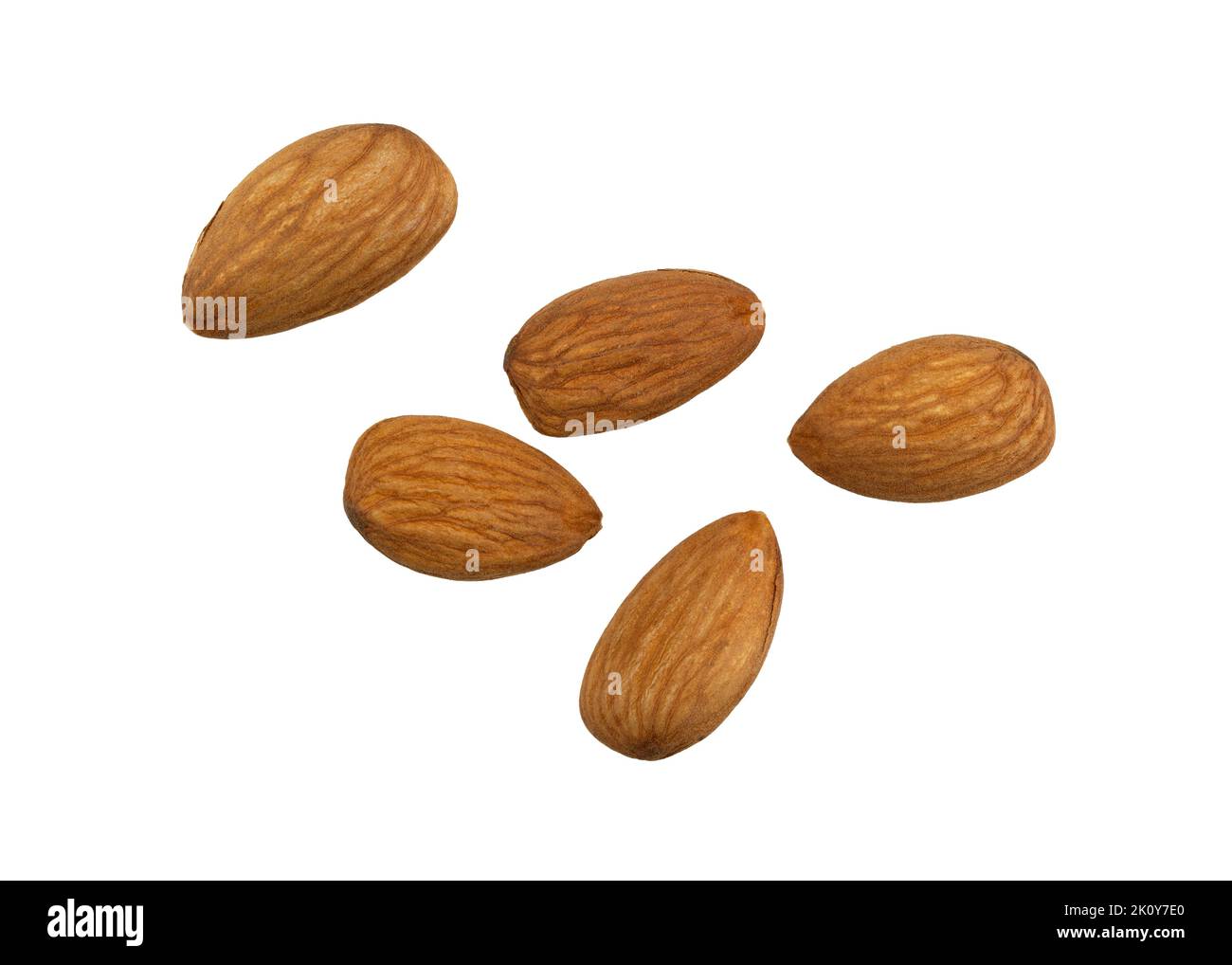 Overhead view of a small group of almond nuts isolated on a white ...