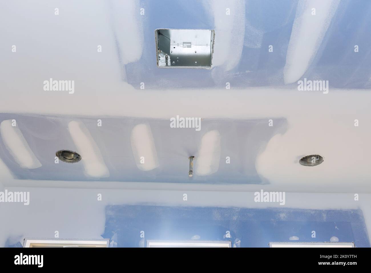 A newly constructed house is in the process of being plastered and the ...
