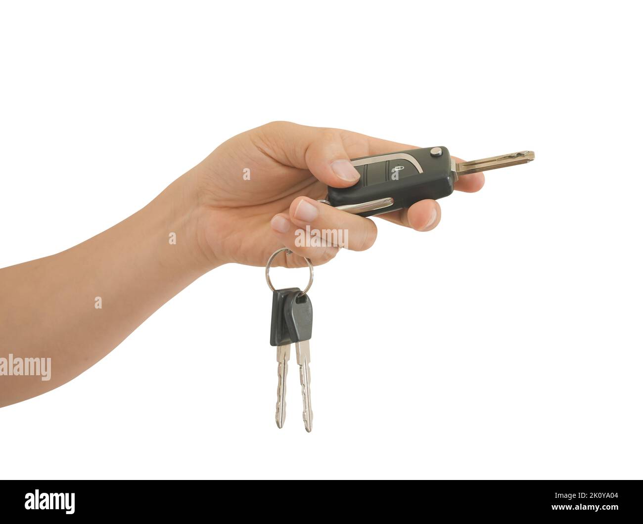 Male hand holds a black car key isolated on white background with ...