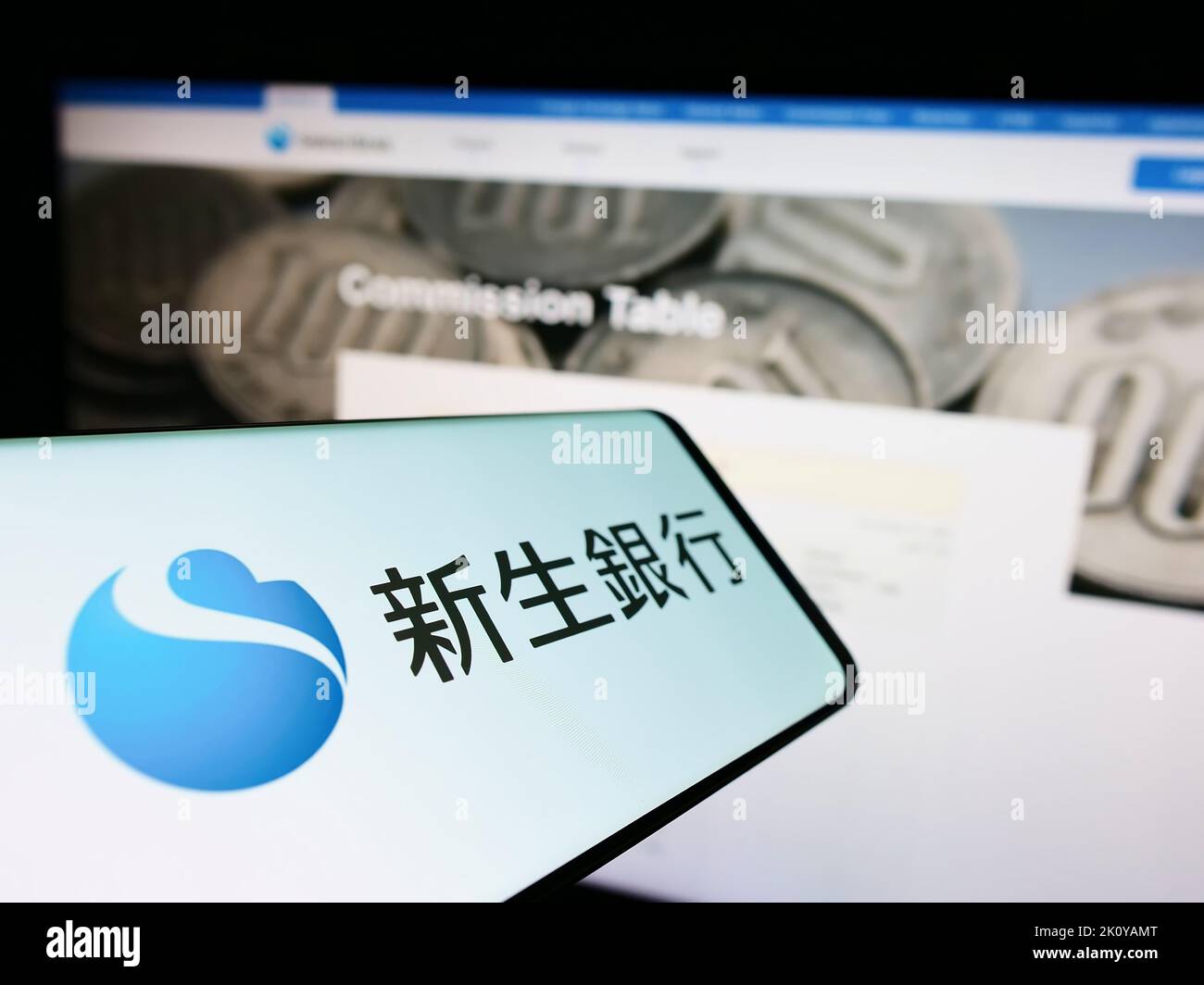 Mobile phone with logo of Japanese financial company Shinsei Bank ...