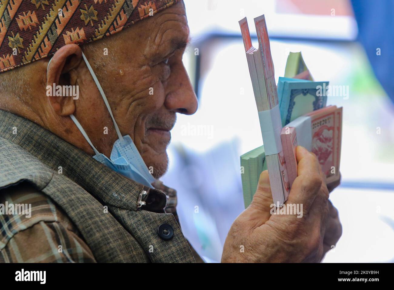 On September.14,2022 in Kathmandu, Nepal. A man shows the bunddles of ...